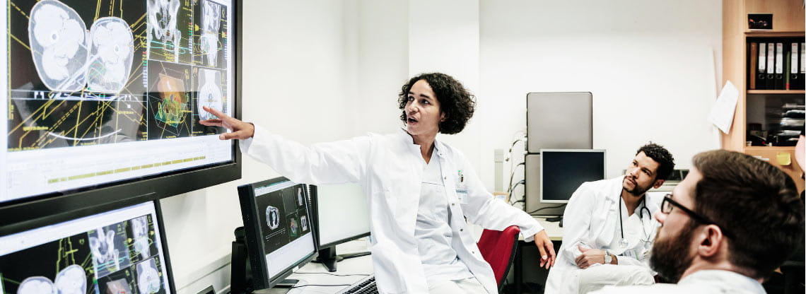 A group of ProMedica doctors discuss a patients test results