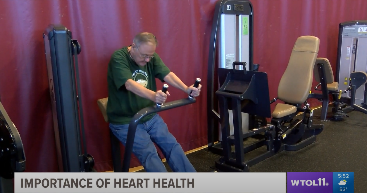 A male patient working out on a machine during his physical therapy ...
